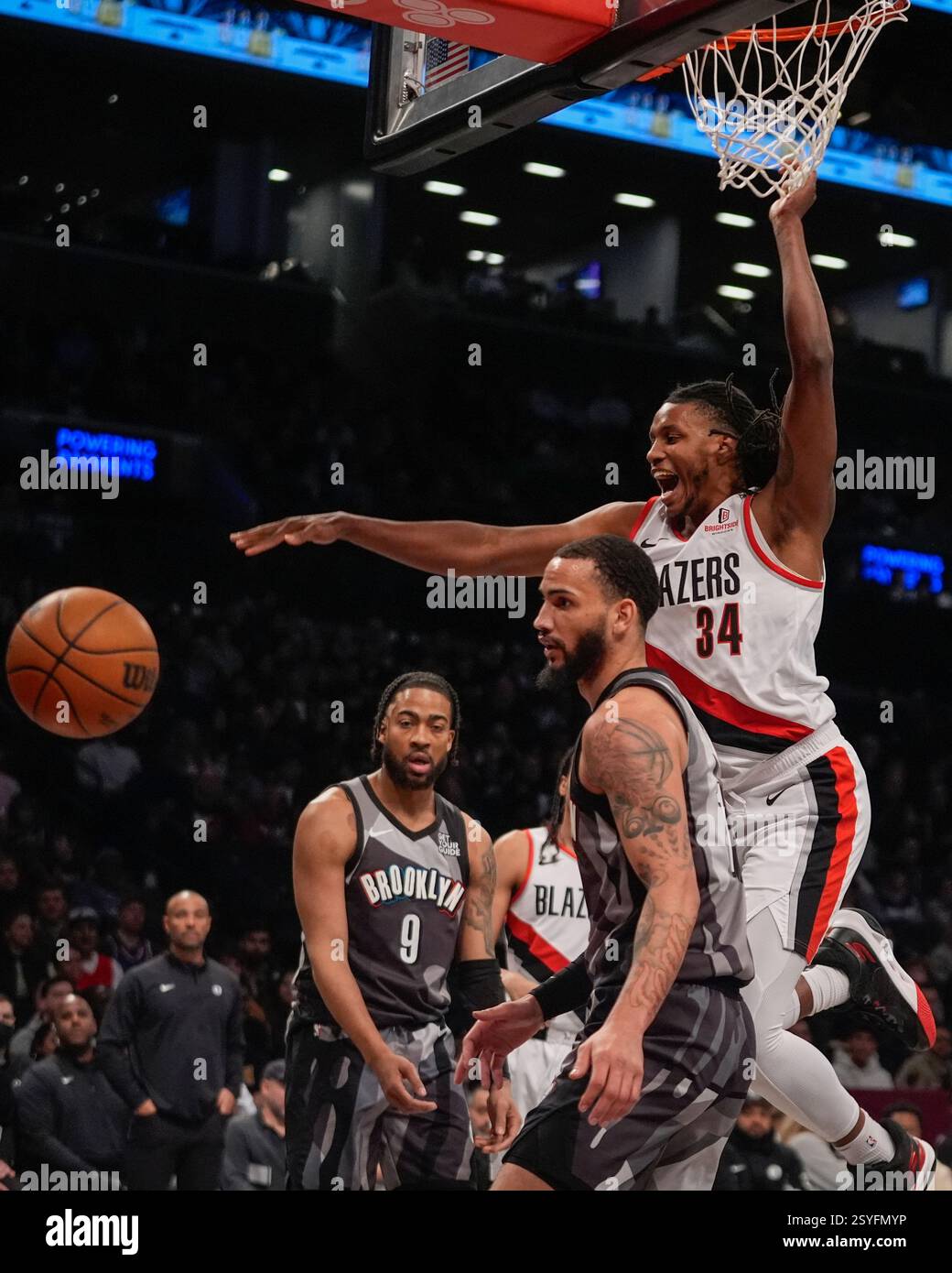 Portland Trail Blazers' Jabari Walker (34) dunks the ball in front of ...