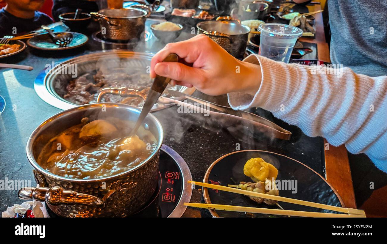 Simmering hotpot vegetables broth hi-res stock photography and images ...