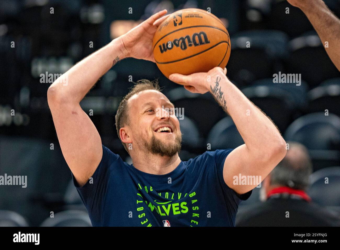 Minnesota Timberwolves guard Joe Ingles jokes with fans as he shoots ...