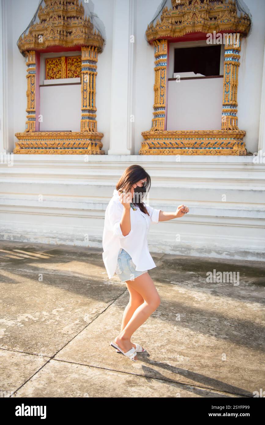 Woman dancing with fun in ordination ceremony in buddhist Thai monk ...
