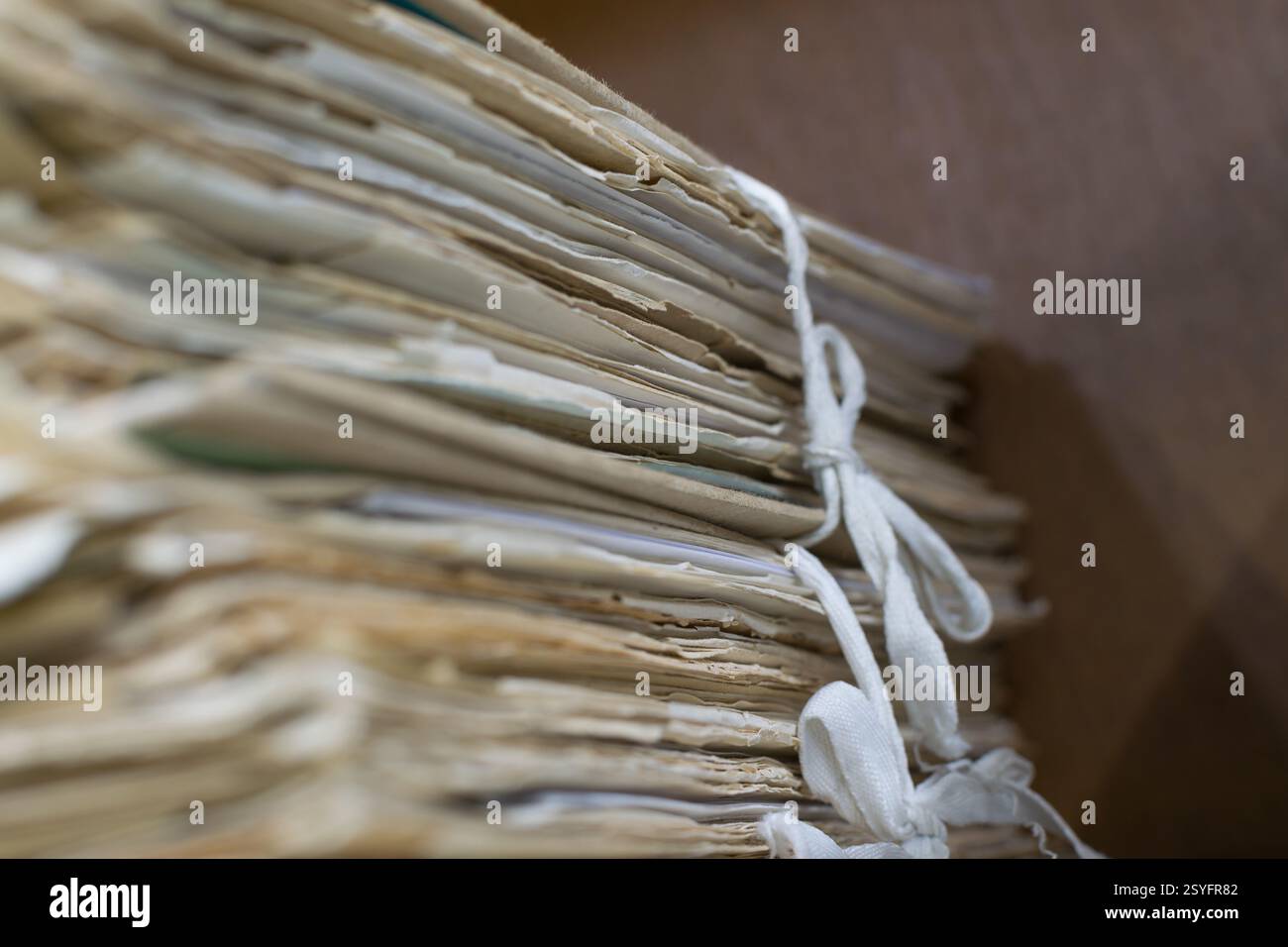 Old files in old folder stacking up in a messy order Stock Photo - Alamy