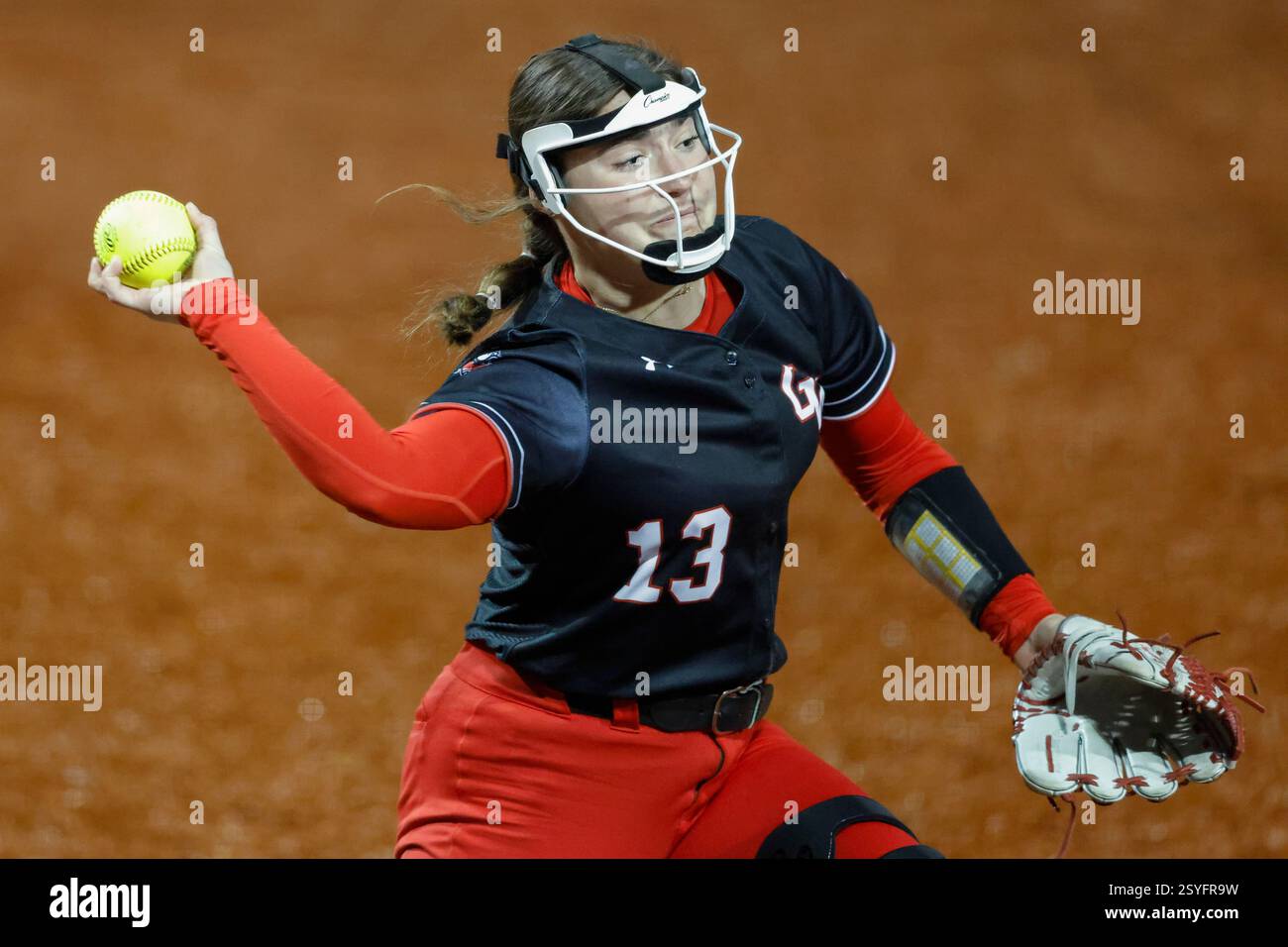 Gardner-Webb pitcher Hannah Frye throws to first base after fielding a ...