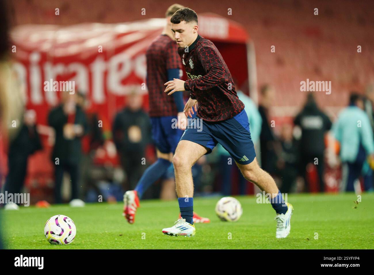 London, UK. 28th Feb, 2025. James Scanlon of Manchester United warming ...