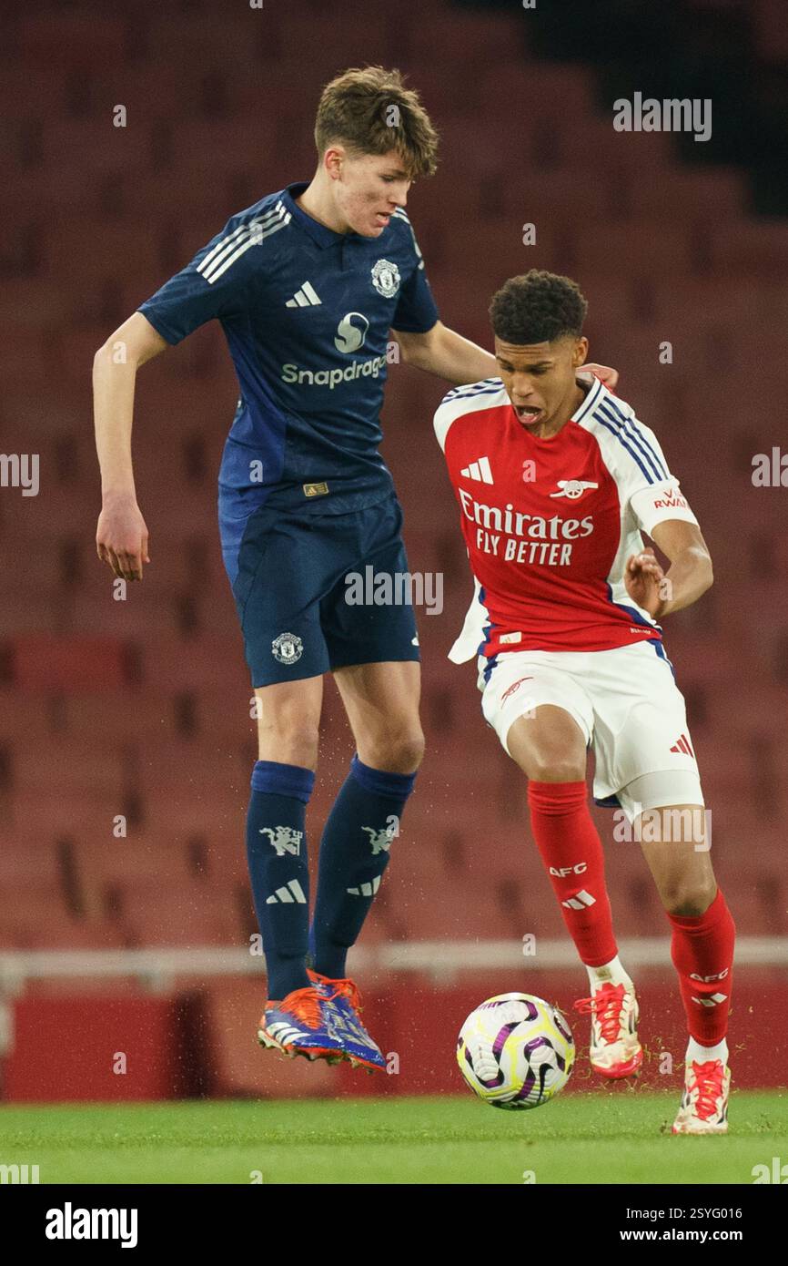 Daniel Armer of Manchester United and Andre Harriman-Annous of Arsenal ...