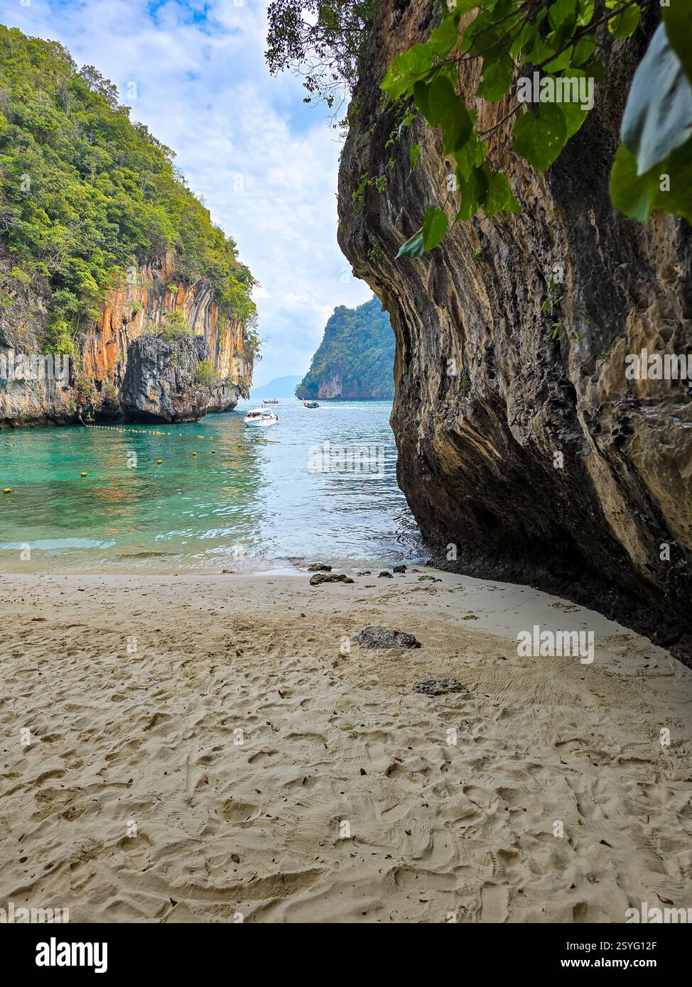 Crystal-clear waters embrace the sandy shores of Koh Lao Lading Island ...