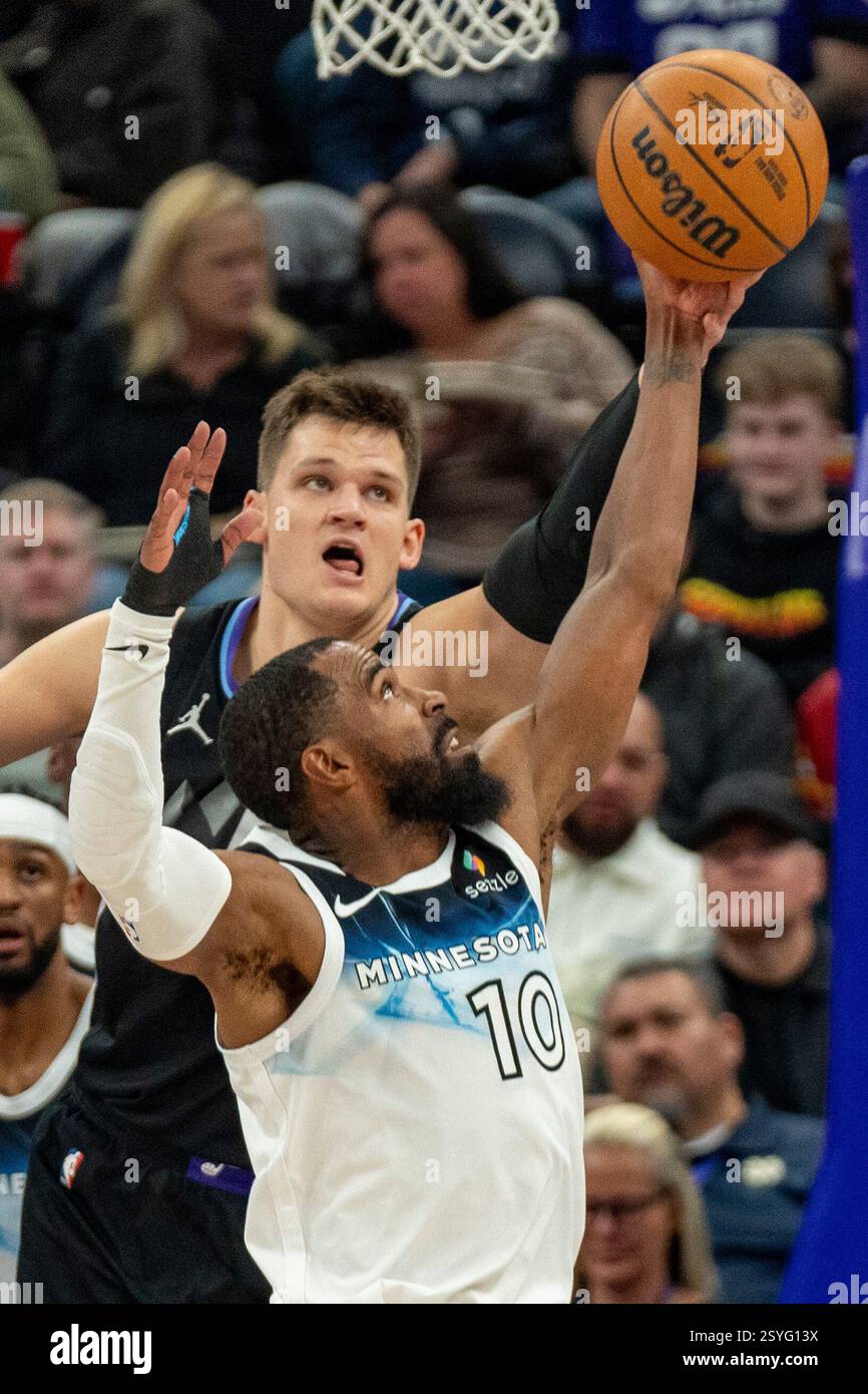 Utah Jazz center Walker Kessler, top, goes for a rebound along with ...