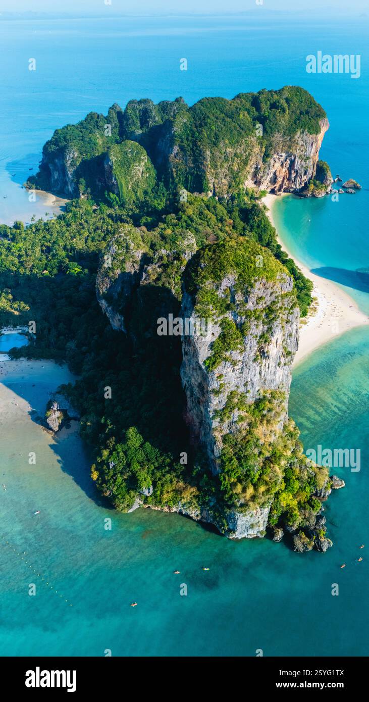 Majestic limestone cliffs rise above crystal-clear turquoise waters ...