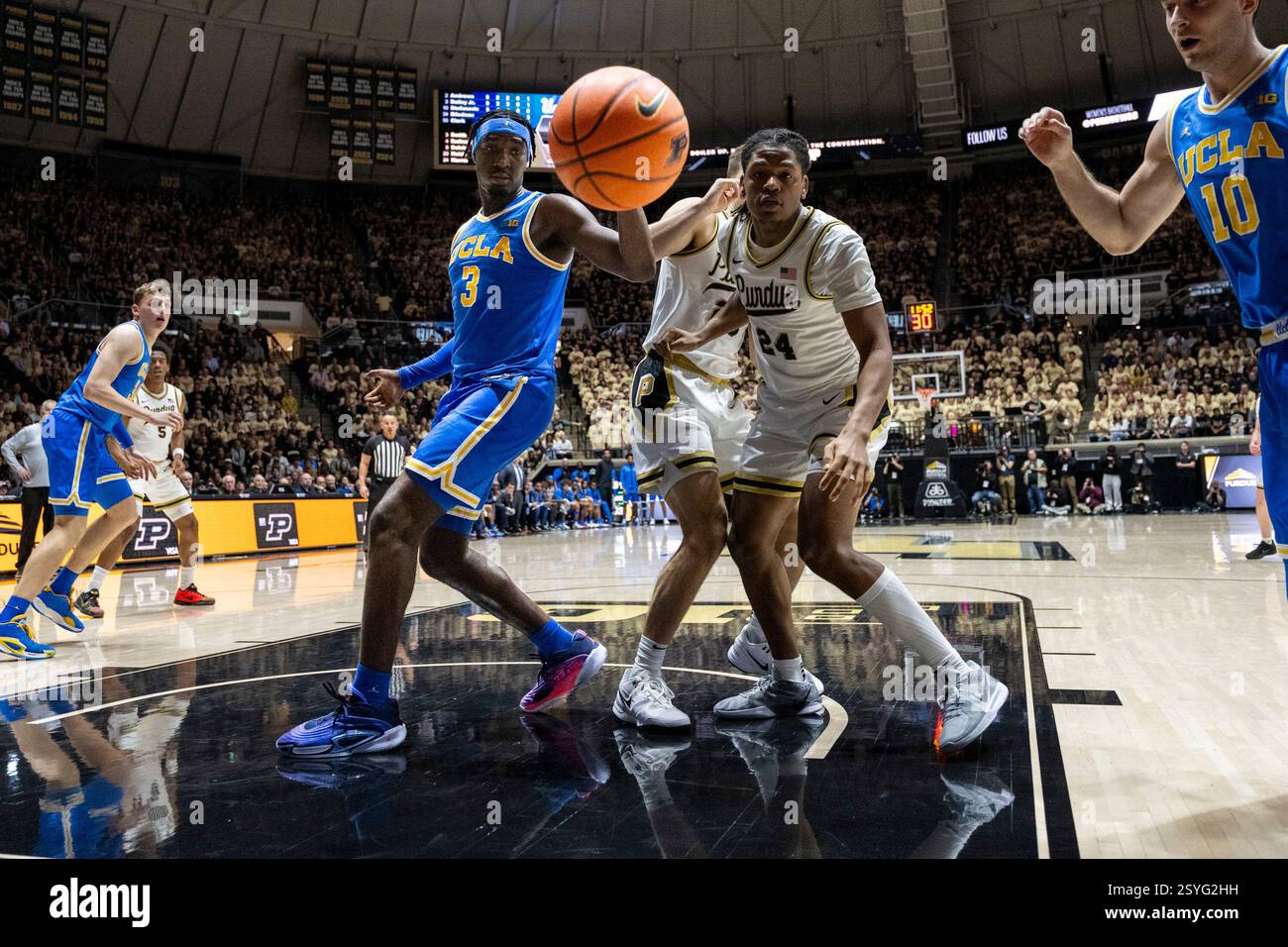 UCLA guard Eric Dailey Jr. (3) and Purdue guard Gicarri Harris (24 ...