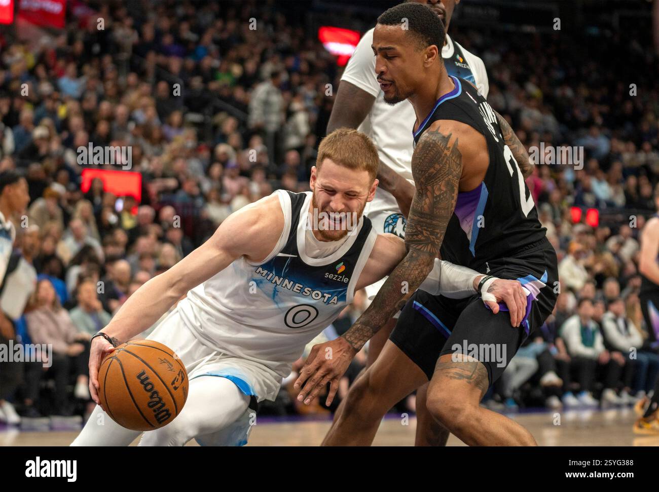 Minnesota Timberwolves guard Donte DiVincenzo (0) dribbles under the ...