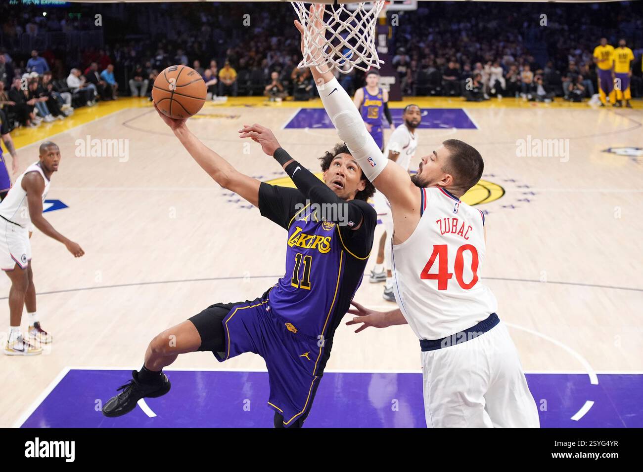 Los Angeles Lakers center Jaxson Hayes (11) goes up for a dunk as Los ...