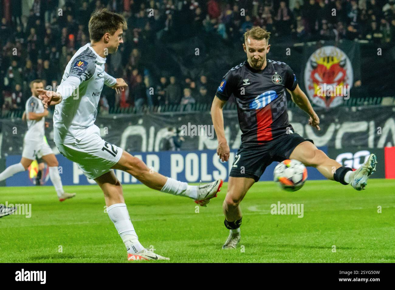 Warsaw, Poland. 27th Feb, 2025. Mateusz Stepien (L) of Puszcza ...