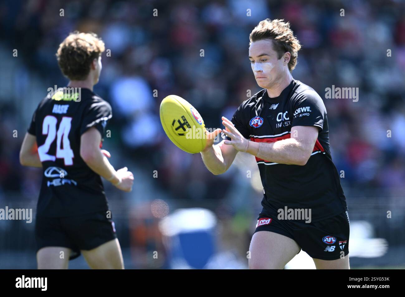 Melbourne, Australia. 01st Mar, 2025. Ryan Byrnes of St Kilda warms up ...