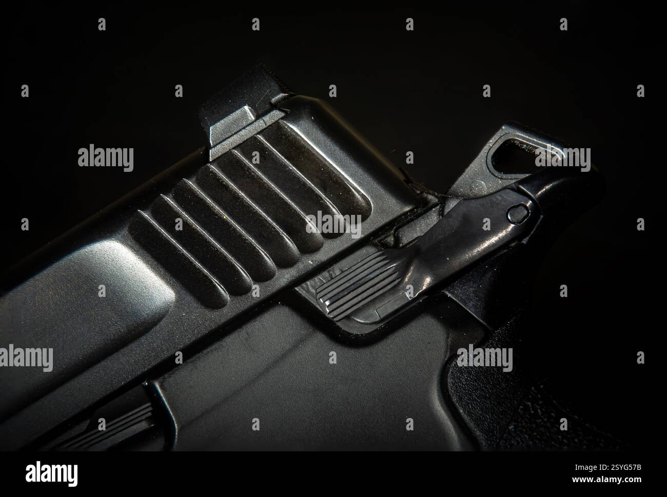 Close-up shot of a hammer fired pistol with its safety mechanism turned ...