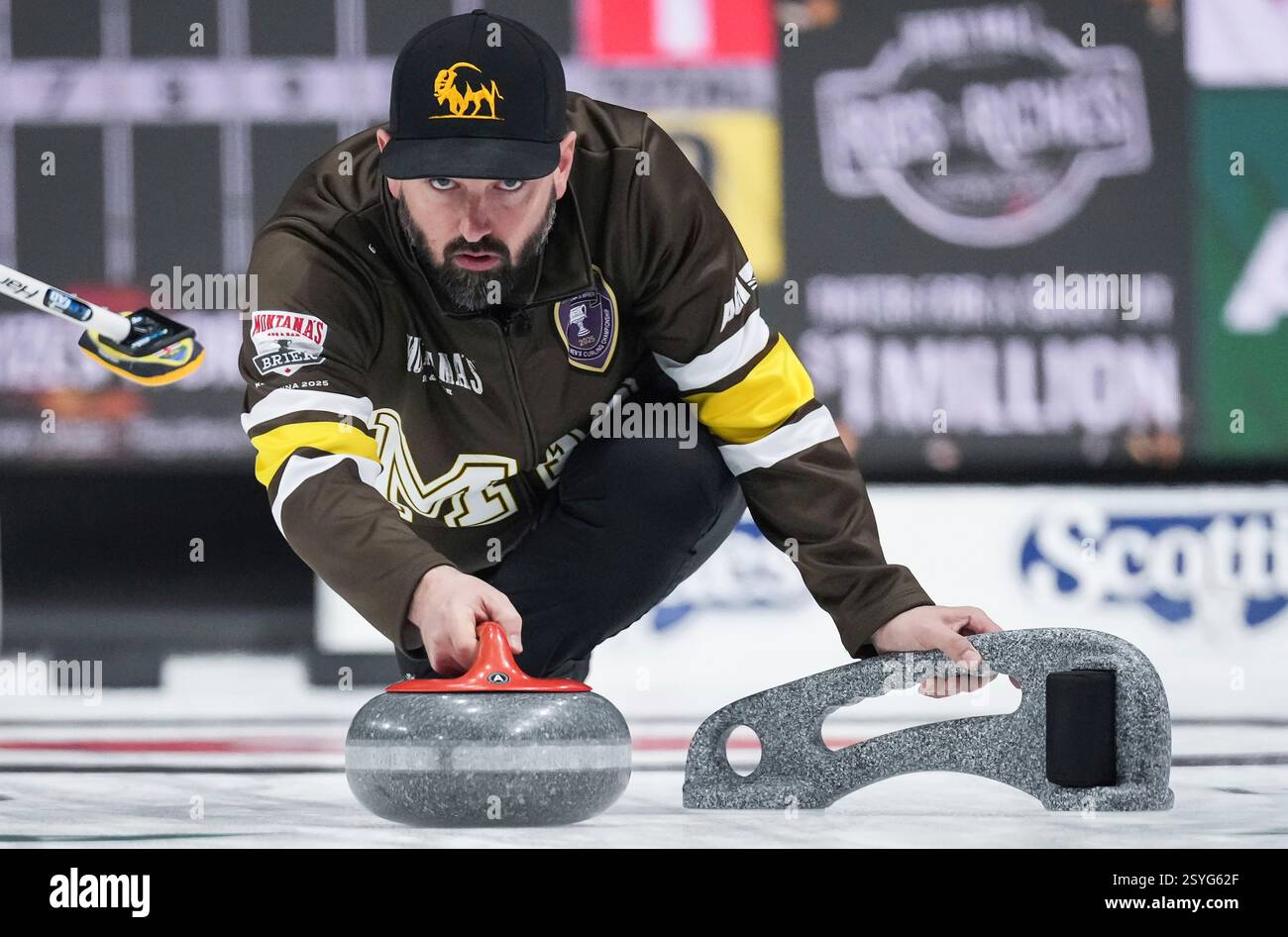 Manitoba-Carruthers skip Reid Carruthers delivers a rock while playing ...