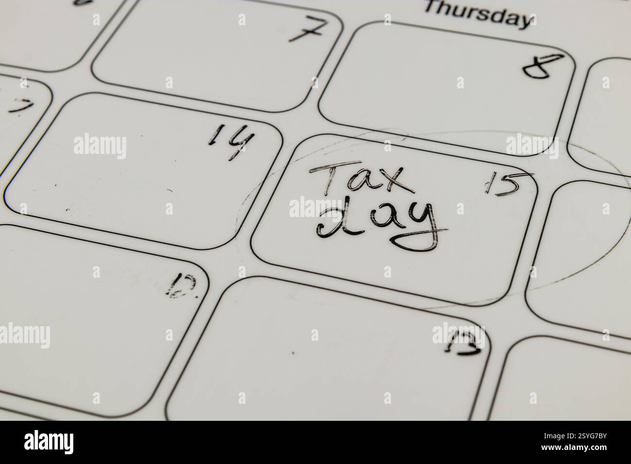 A handwritten note marks tax day on a calendar, indicating the urgency ...