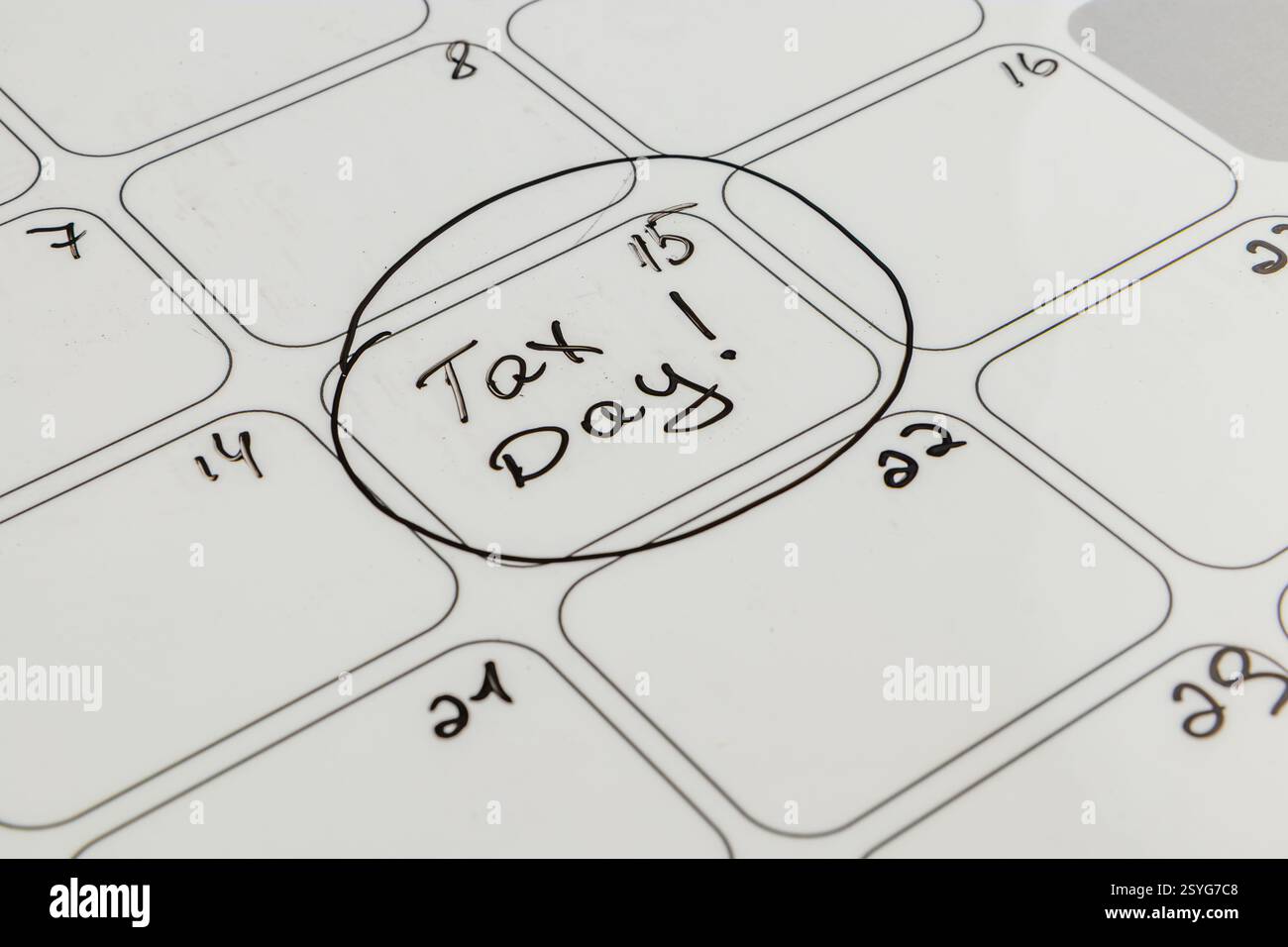 A calendar displays an important date highlighted with the note Tax Day ...