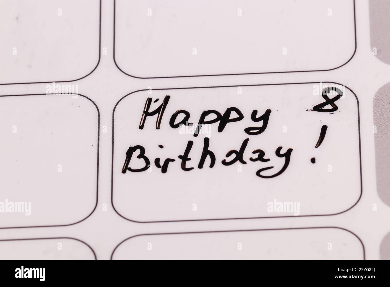 A joyful birthday message is handwritten in black ink, celebrating an ...