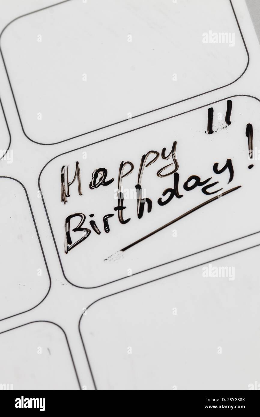 A cheerful birthday message is inscribed on a whiteboard, highlighting ...