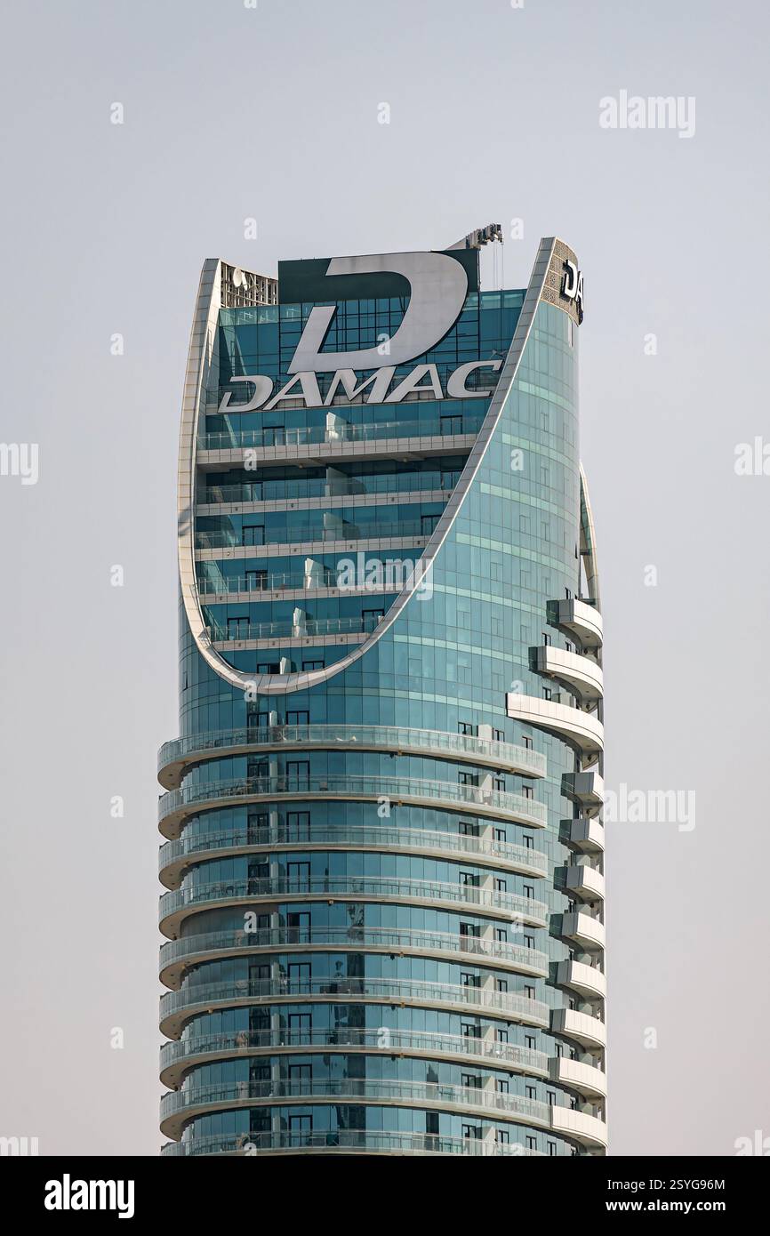 DAMAC Maison Distinction hotel tower. Damac development company logo on ...