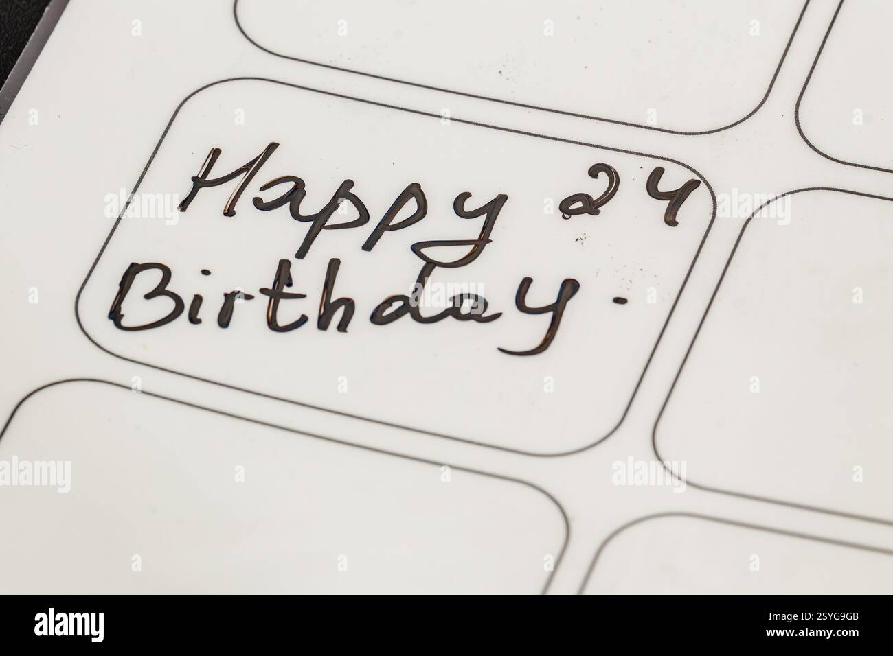 A handwritten note expresses joy for someone turning 24. The words ...