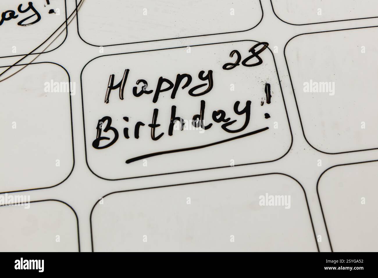 Dark ink scrawls across a calendar's date box, celebrating a 28th ...
