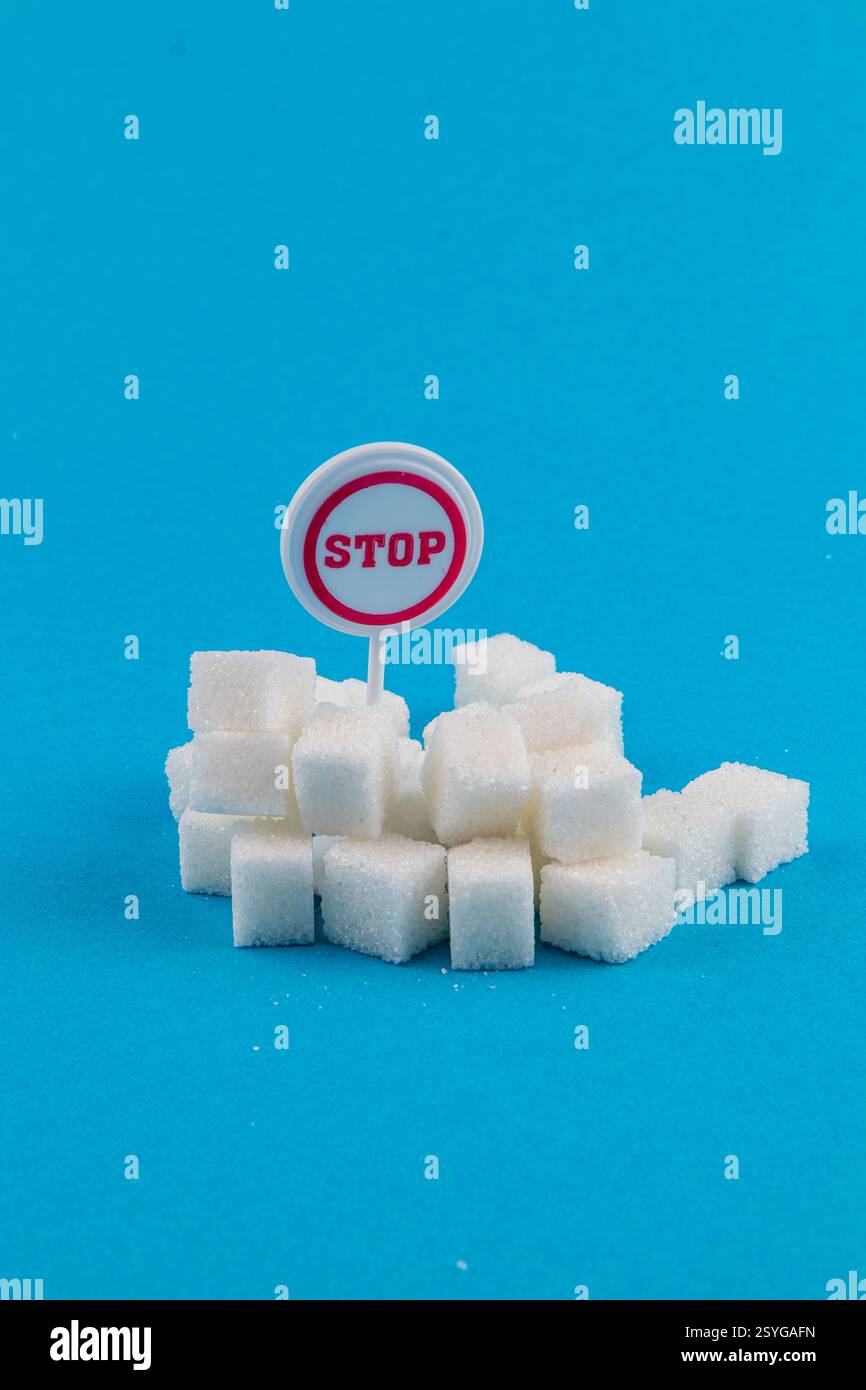 A creative display shows stacked sugar cubes with a stop sign ...