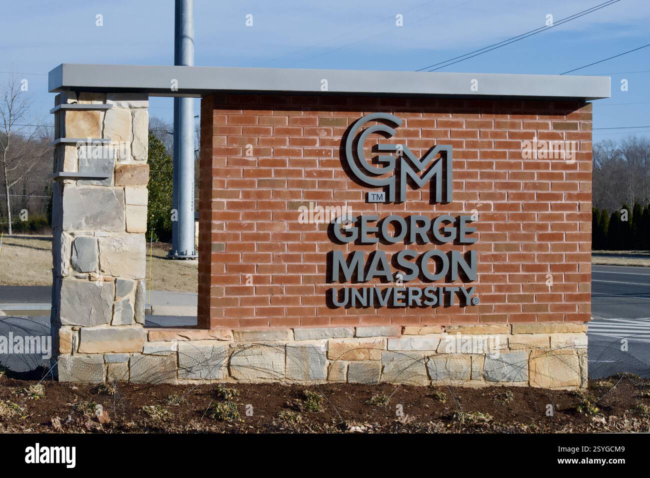 Fairfax, Virginia, USA - February 28, 2025: A brick sign at an entrance ...