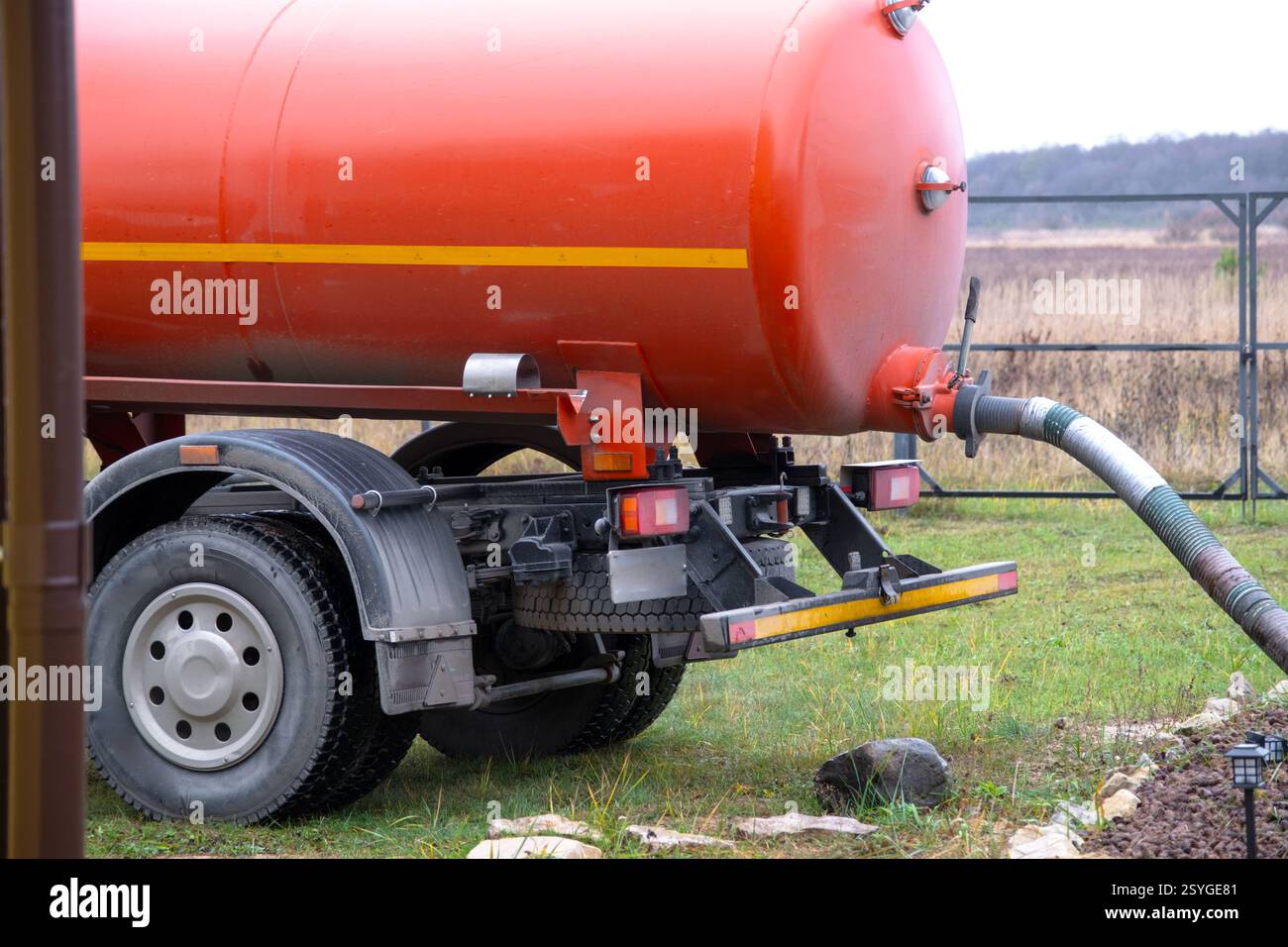 The orange tank of the sewage disposal machine in the courtyard of the ...