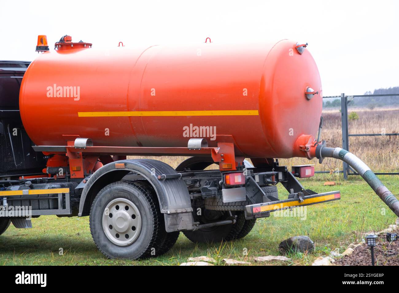 The orange tank of the sewage disposal machine in the courtyard of the ...