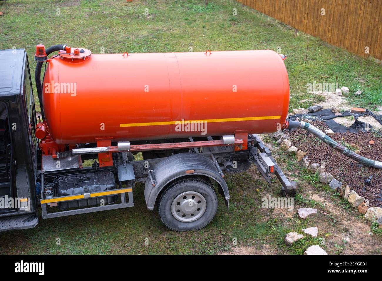 The orange tank of the sewage disposal machine in the courtyard of the ...