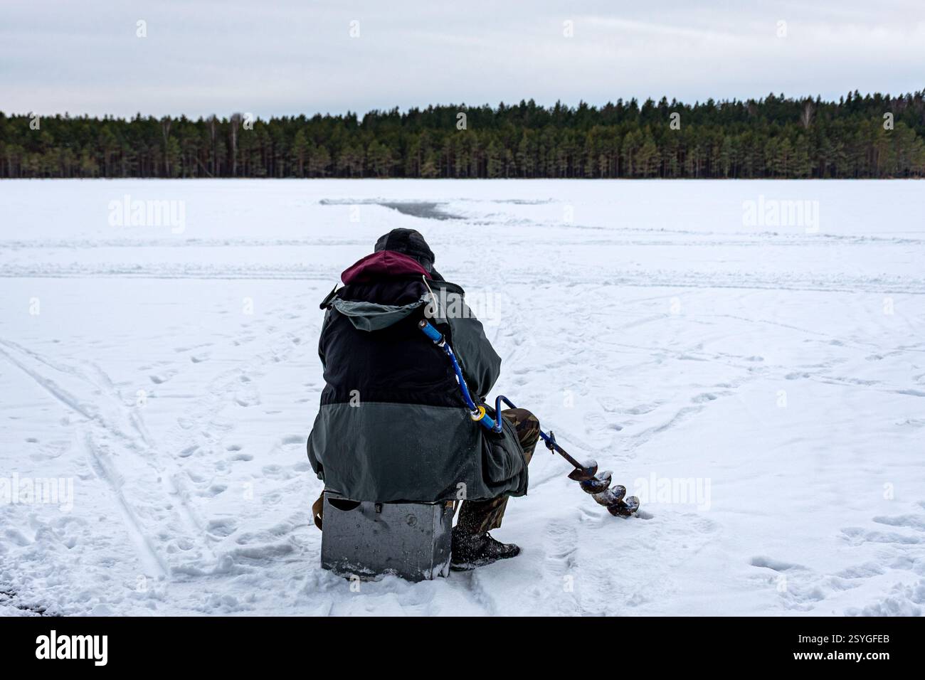 photography with an ice fisherman on a lake, recreation in nature ...