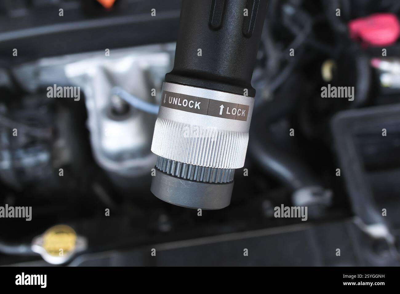 Close up of a lock and unlock torque scale adjuster of torque wrench ...