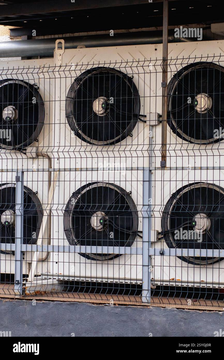 A whole cluster of air conditioners is meticulously lined up neatly on ...
