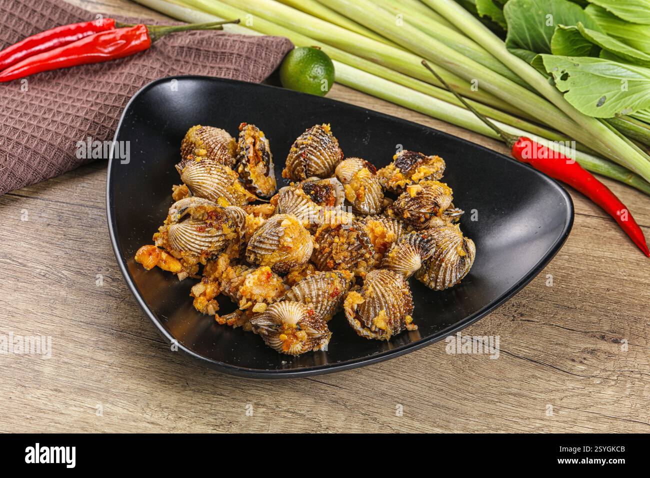 Blood Cockle Fried With Garlic and spices Stock Photo - Alamy