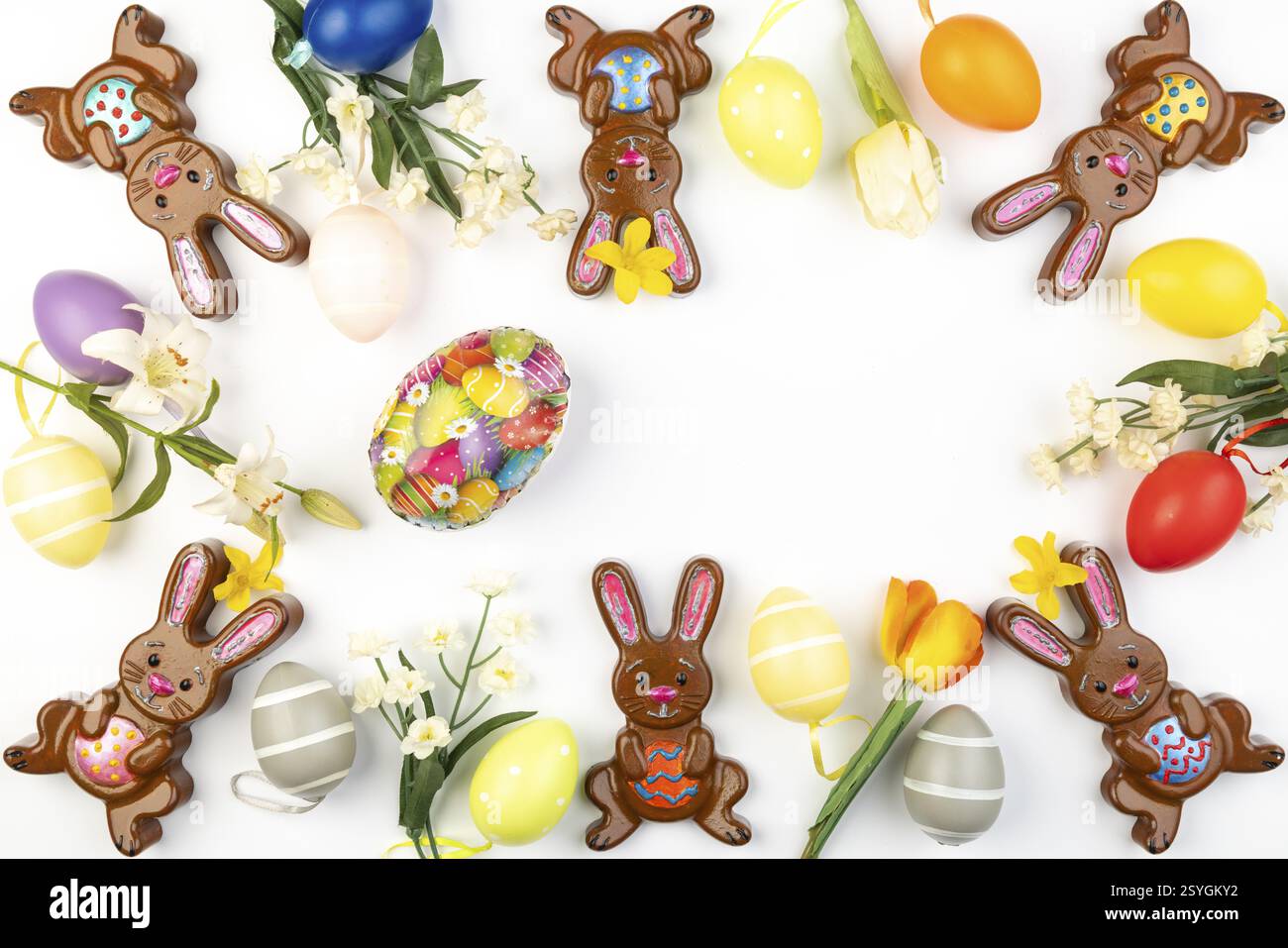 Frame made of colourfully decorated Easter bunnies, Easter eggs and ...