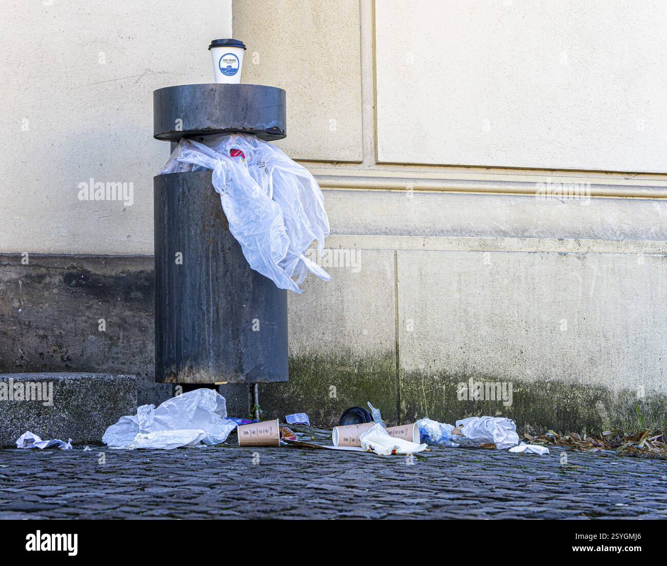 Overfilled rubbish bin in the public street, Berlin, Germany, Europe ...