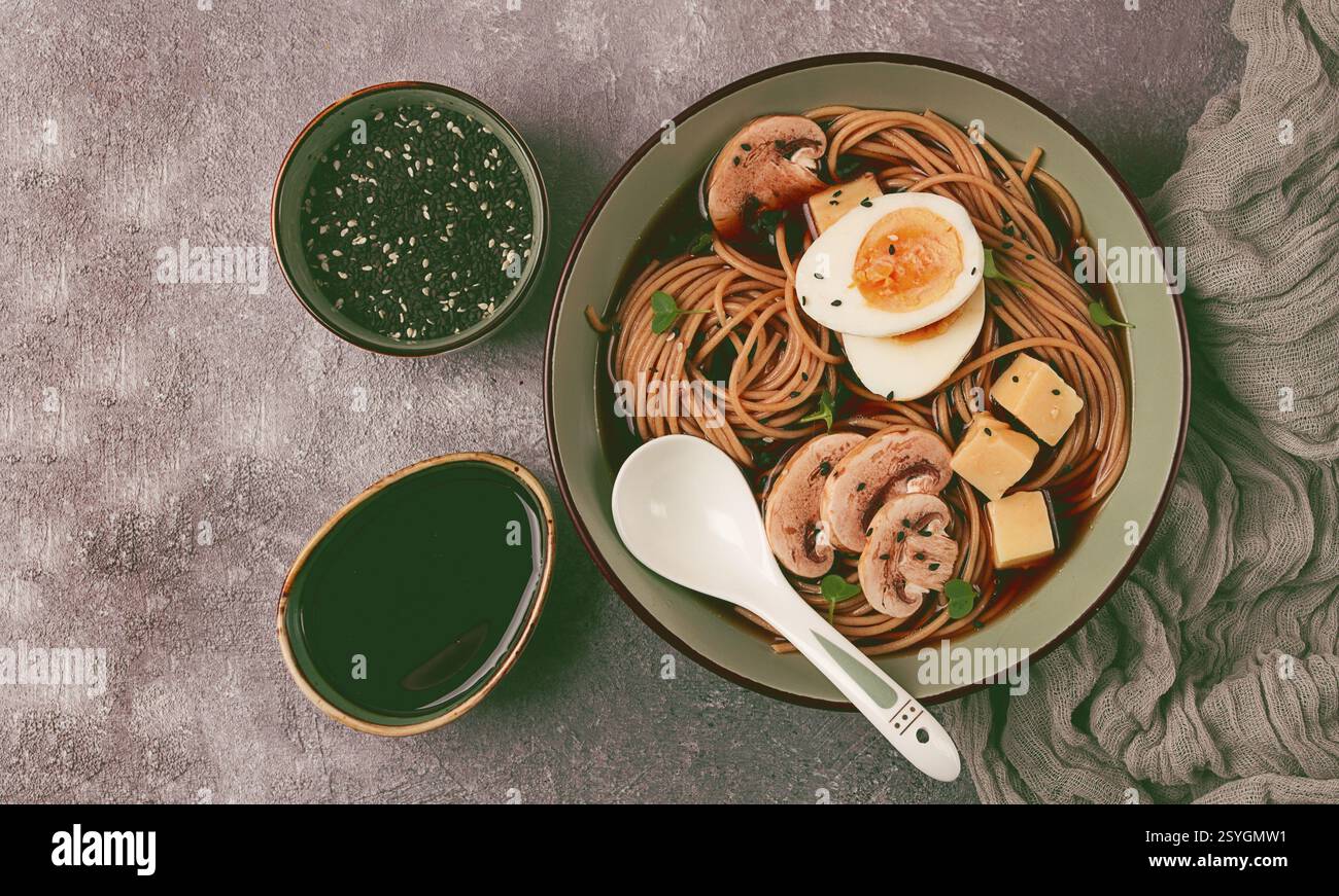 Asian soba soup, with mushrooms and egg, cheese, sesame seeds, homemade ...