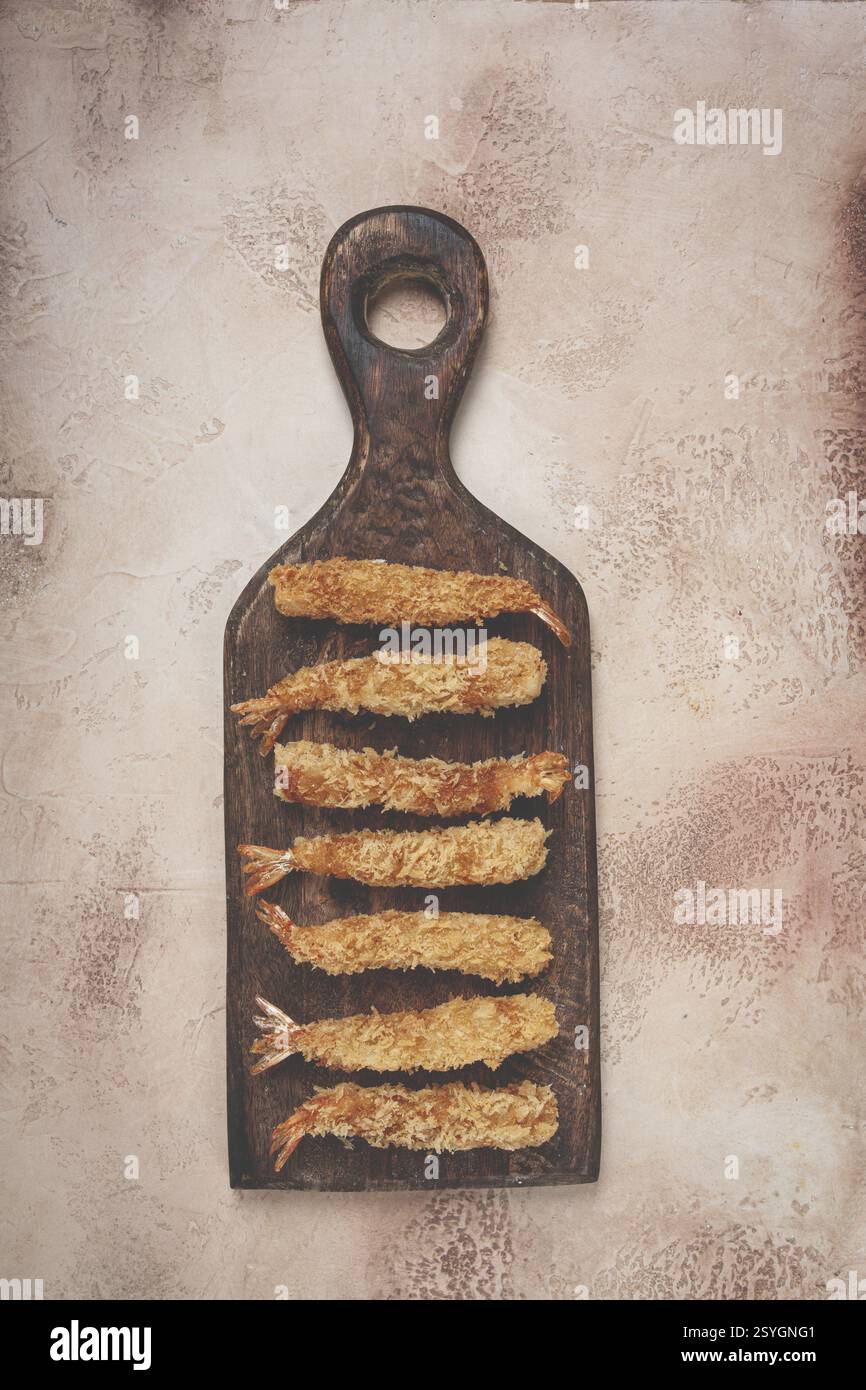 Shrimp in tempura, deep fried, on a wooden board, top view, no people ...