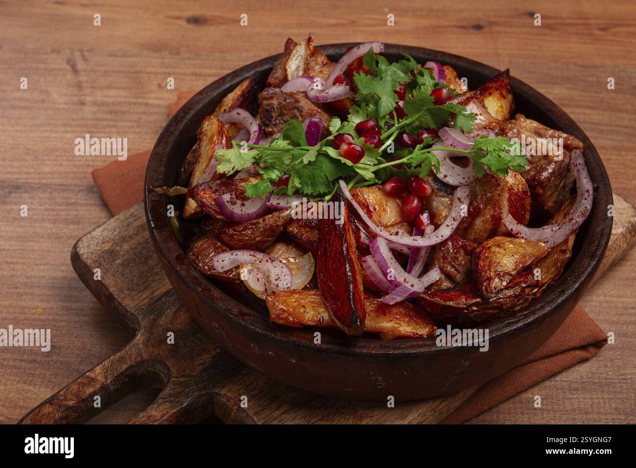 Ojakhuri, a traditional Georgian dish, fried potatoes with meat, in a ...