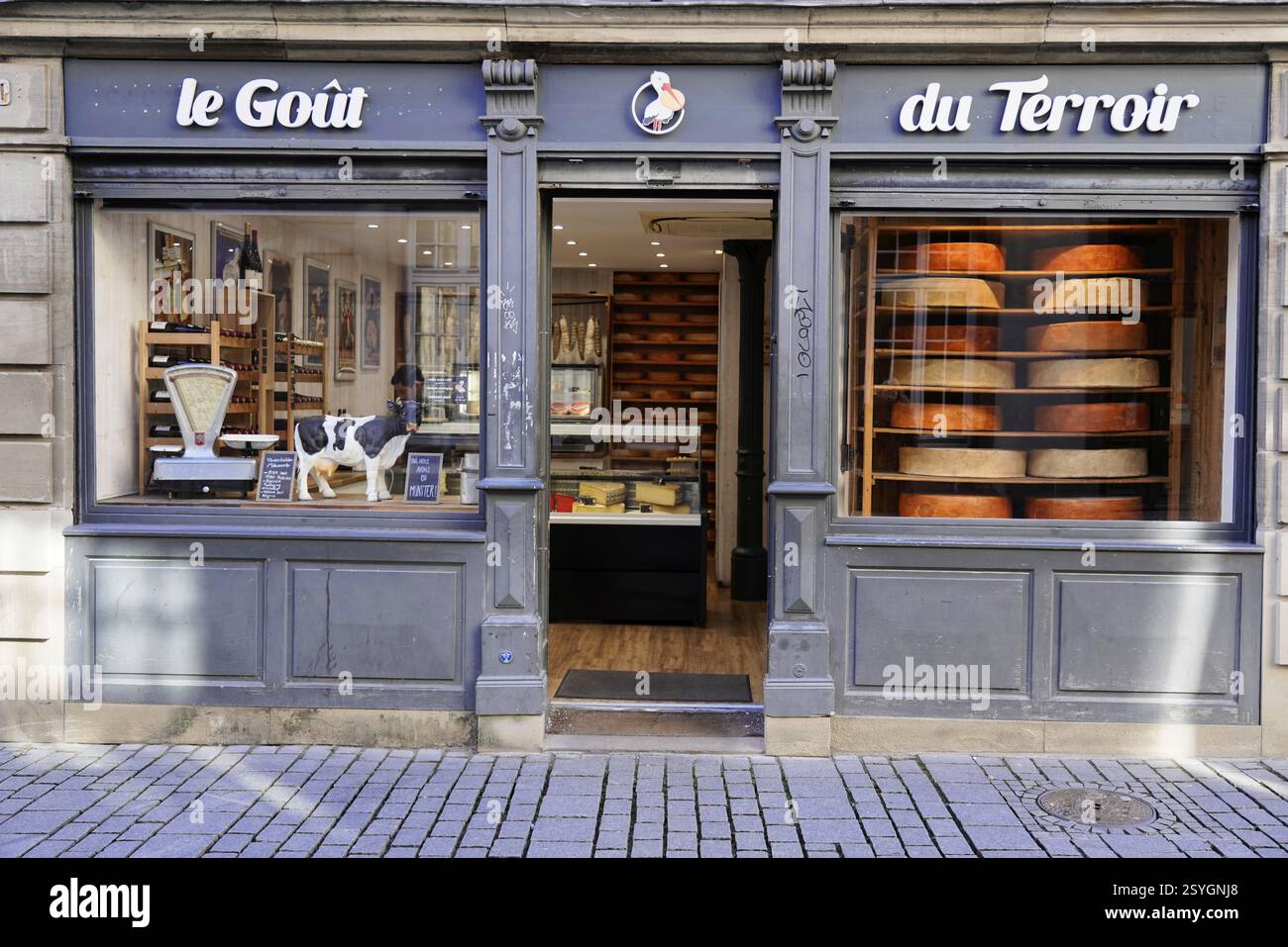 Traditional shop with a window full of cheese and a welcoming facade ...