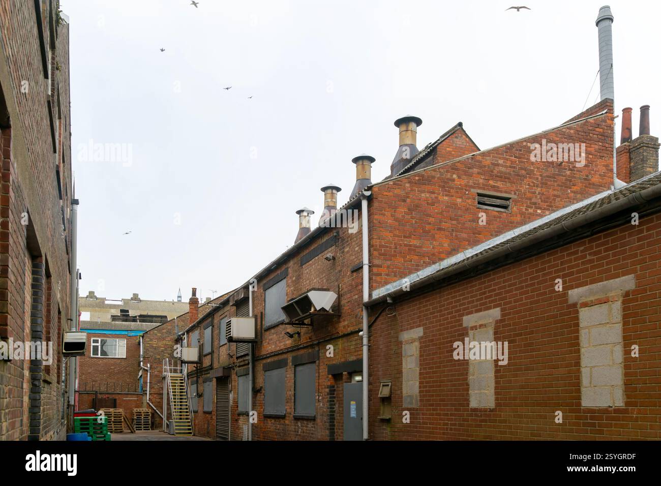 Chimneys of fish smoking business building Grimsby docks, north east ...