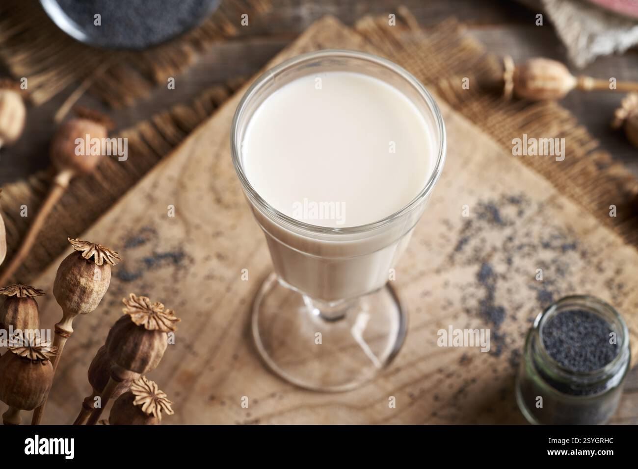 Homemade vegan poppy seed milk in a glass cup Stock Photo - Alamy