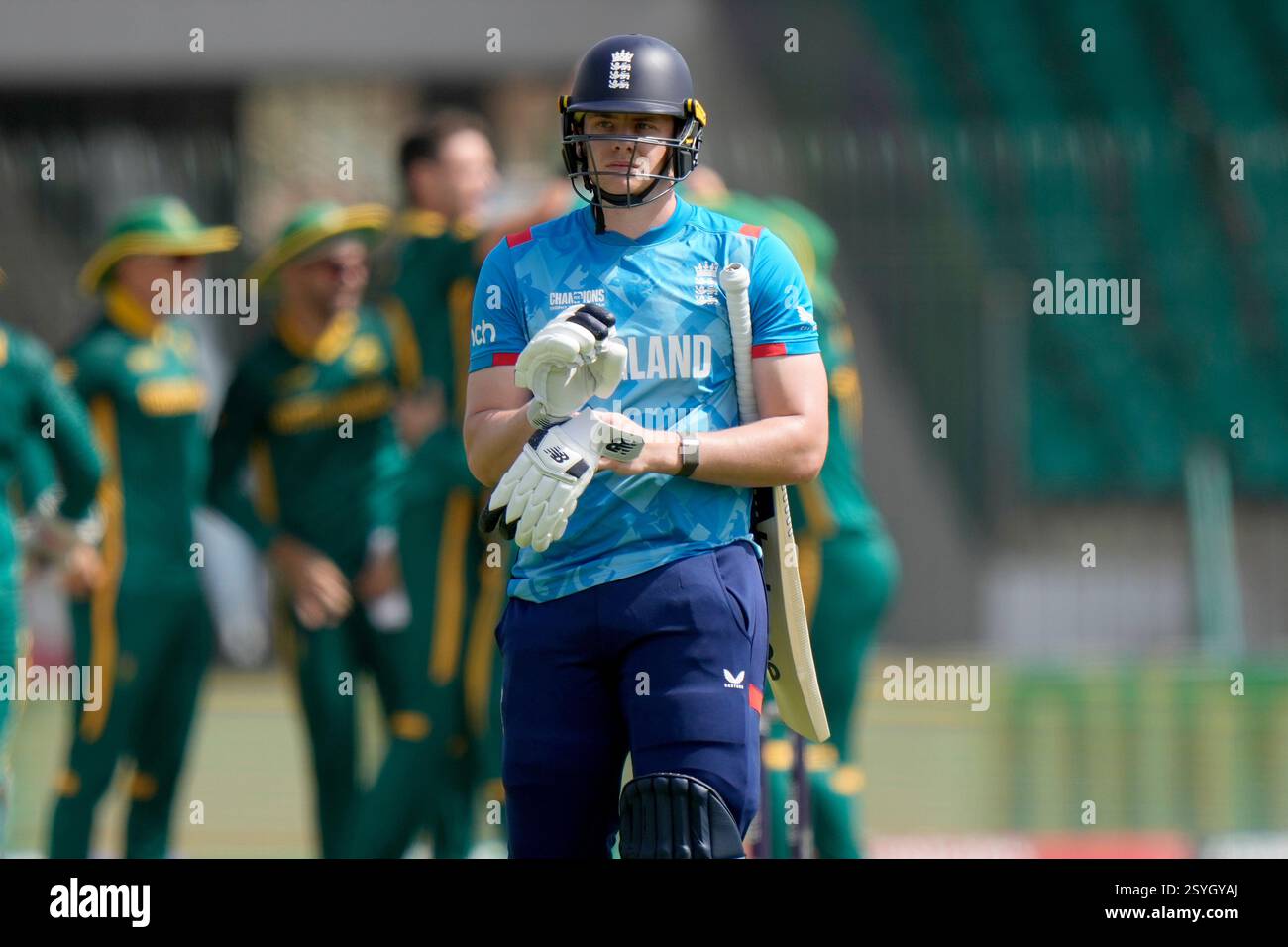 England's Jamie Smith walks off the field after his dismissal during ...