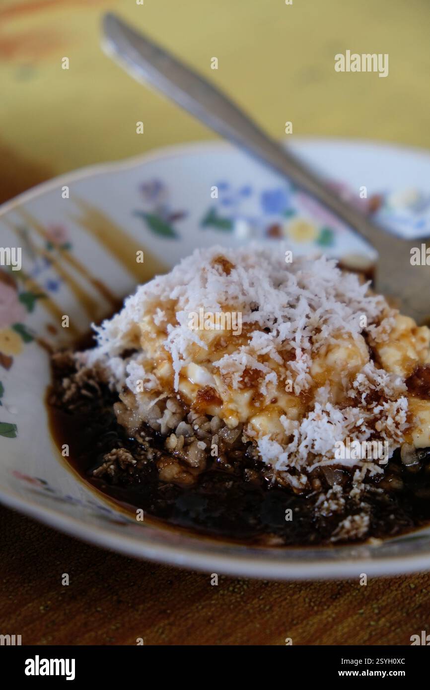 Ampiang dadiah is West Sumatera traditional food made from sticky rice ...