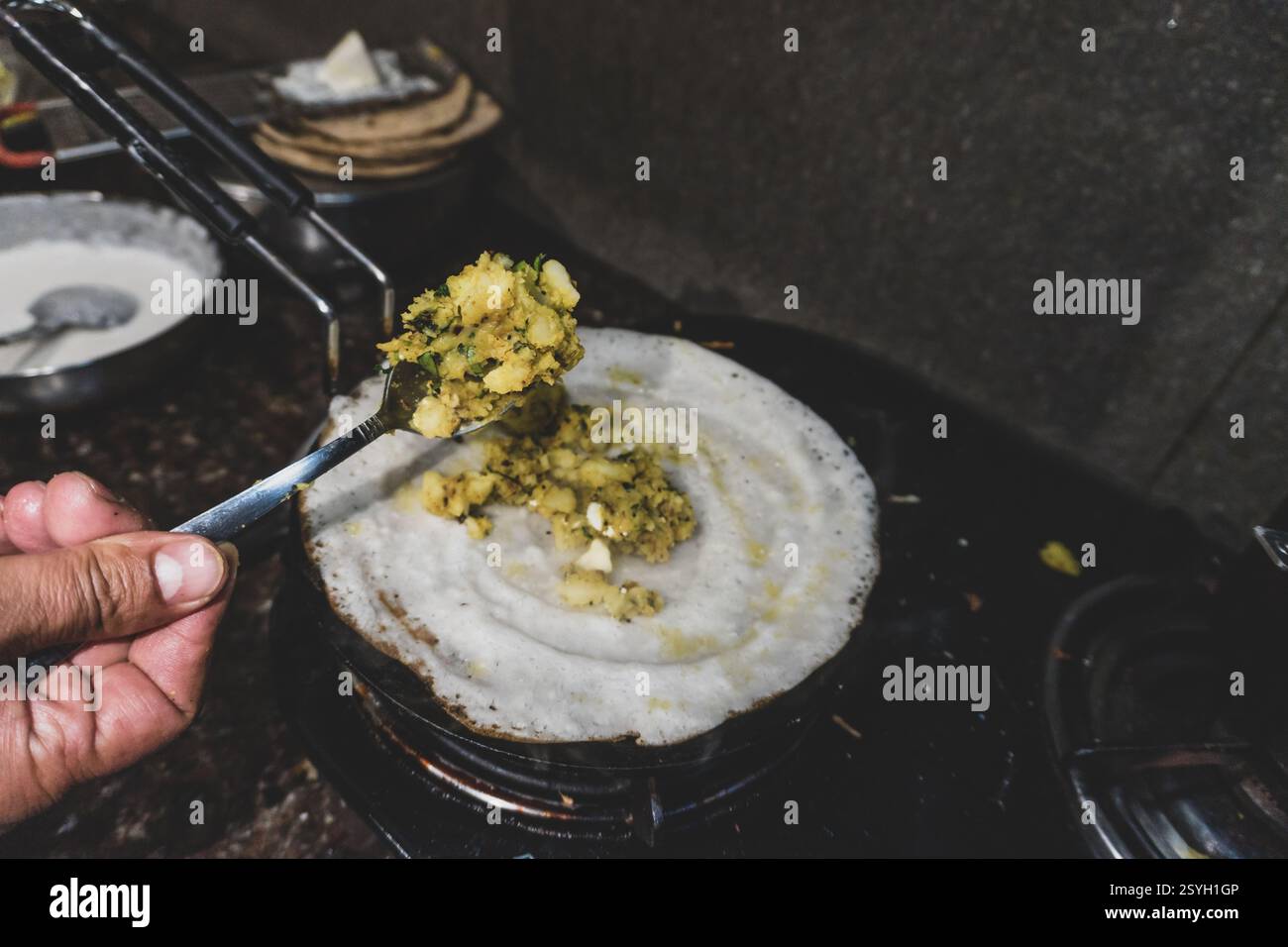 Homemade South Indian masala dosa with potato and shredded cheese ...