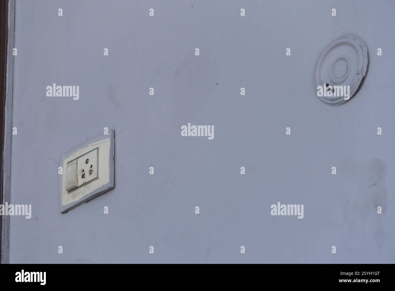 Electrical switchboard and wiring pass-through on a residential wall in ...