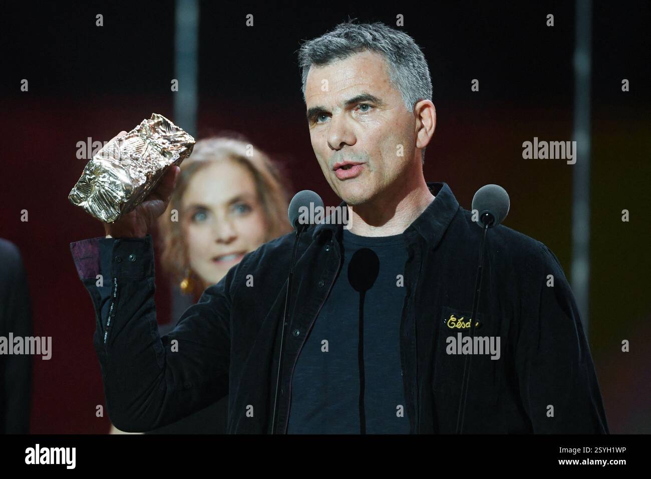 Paris, France. 25th Feb, 2025. Gilles Perret receives the Best ...
