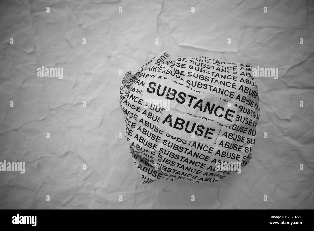 Crumpled paper ball with words Substance Abuse on torn white paper ...