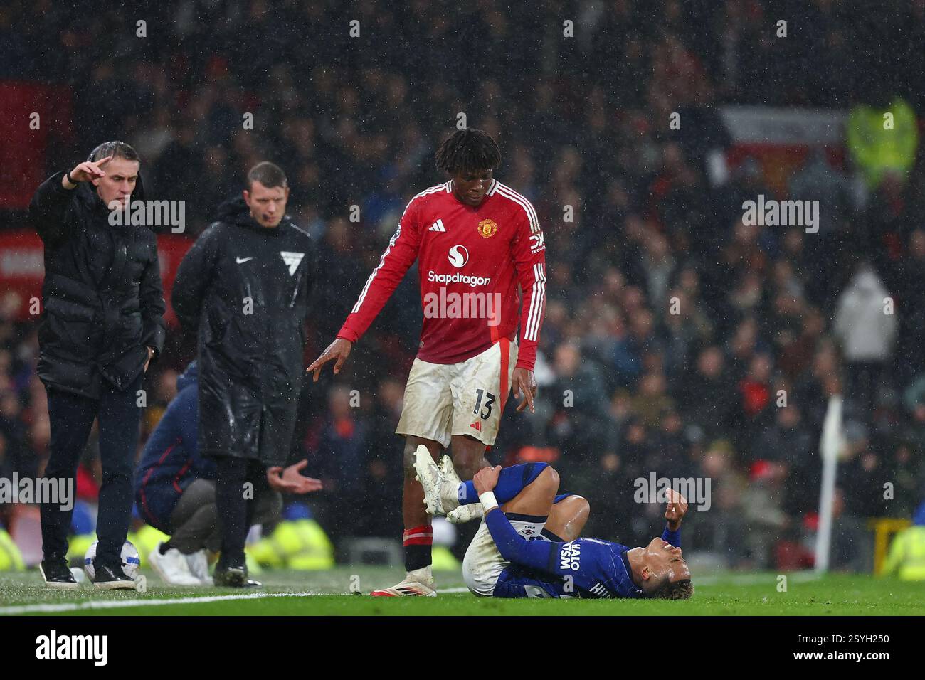 Patrick Dorgu of Manchester United fouls Omari Hutchinson of Ipswich ...