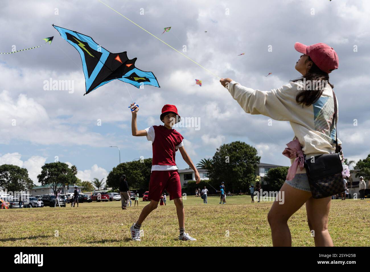 Auckland, New Zealand. 1st Mar, 2025. People fly kites at a park in ...